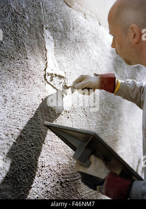 A man building a wall, Uppsala, Sweden Stock Photo - Alamy