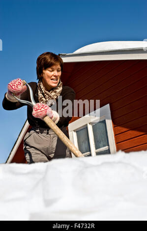One women shovelling snow in the snowstrom. Cleaning stairs Stock Photo ...