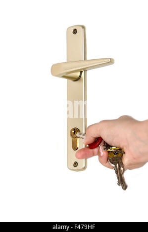 female hand putting house key into front door lock of house, Woman ...