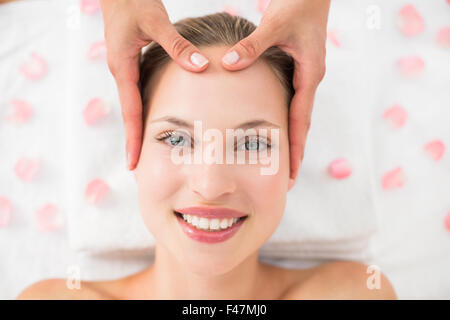 pretty blonde receiving head massage Stock Photo - Alamy