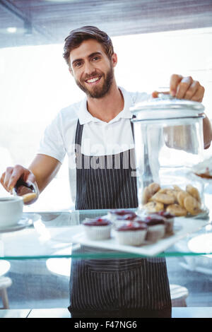 Smiling worker prepares breakfast Stock Photo - Alamy