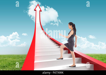Composite image of businesswoman pointing up Stock Photo - Alamy