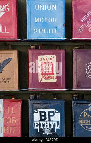 Old shell motor oil metal cans Stock Photo - Alamy