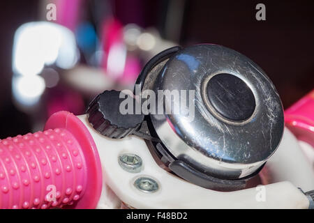Pink bell on bicycle handlebars Stock Photo - Alamy