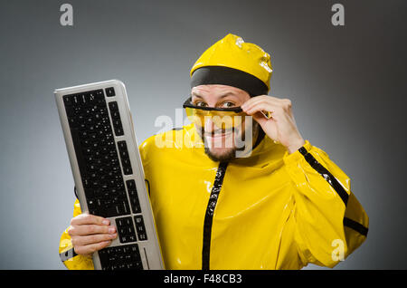 Man wearing yellow suit with keyboard Stock Photo - Alamy