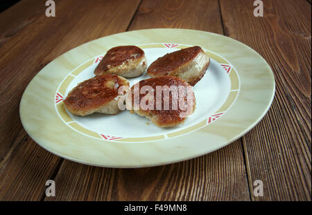 Cooked breakfast, hogs pudding fried egg and bread with baked beans on ...