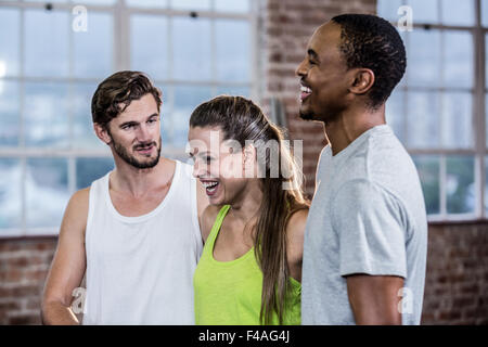 Group of young sporty people smiling happy training yoga at sport ...