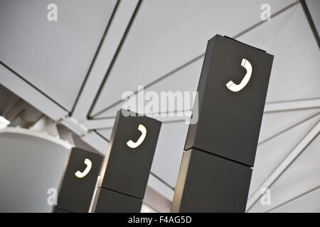 Row of public telephone booths with modern design, equipped with ...