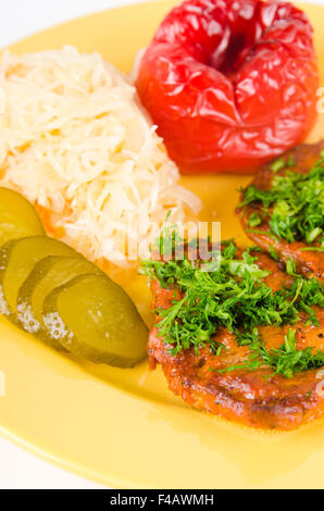 A dish of grilled and stewed vegetables on the background of the river ...