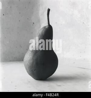 Pear fruit with a shadow Stock Photo - Alamy