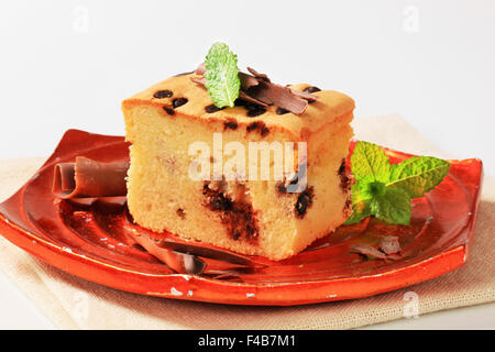 piece of chocolate chip sponge cake Stock Photo - Alamy