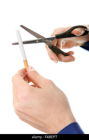Person cutting a Cigarette with Scissors Closeup on the White ...