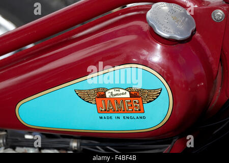 A vintage James motorcycle fuel tank with rain dripping down the ...