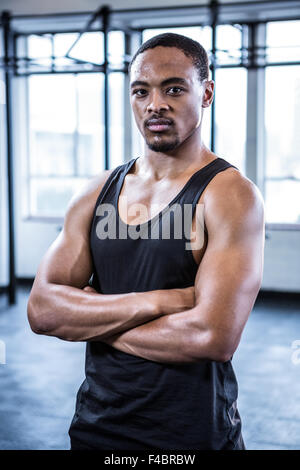 Handsome bodybuilder with arms crossed Stock Photo - Alamy