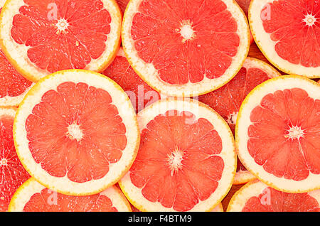 Close-up of fresh grapefruit slice on white background. Slice of red ...