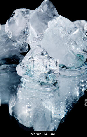 Transparent chunks of ice on frozen water surface Stock Photo - Alamy