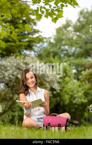 Portrait, smile and exam with girl in classroom for test, child ...