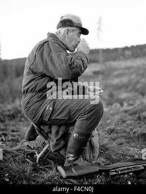 Hunter having a coffee break Stock Photo - Alamy