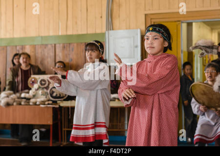 Russia, Chukotka, Chaplino Village, Chukchi boy performing traditional ...