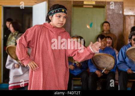 Russia, Chukotka, Chaplino Village, Chukchi boy performing traditional ...