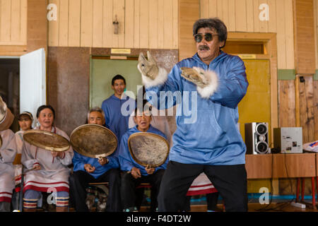 Russia, Chukotka, Chaplino Village, Chukchi boy performing traditional ...