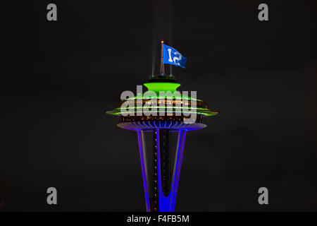 Space Needle with Seahawks green and blue lights, and 12th man flag ...
