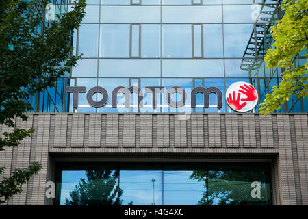 A logo sign outside of the headquarters of TomTom NV in Amsterdam ...