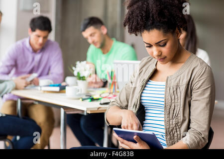 Student working on assignment with tablet Stock Photo - Alamy