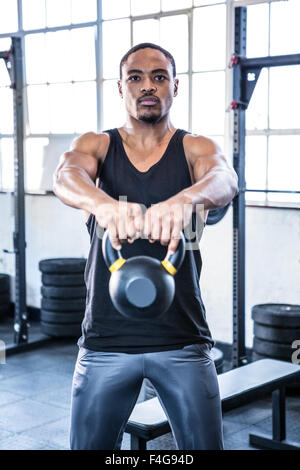 Young fitness man training by kettlebell Stock Photo - Alamy