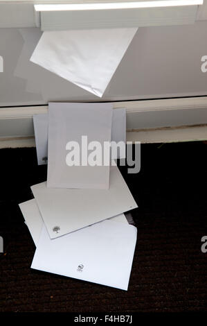 Unopened mail piled up in a wooden letter rack Stock Photo - Alamy
