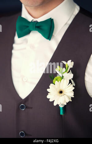 Classy groom dressed in a suit Stock Photo - Alamy