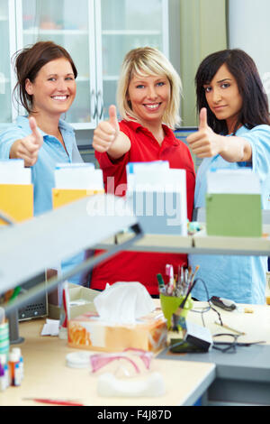 Female lab technician showing thumbs up sign in a laboratory Stock ...