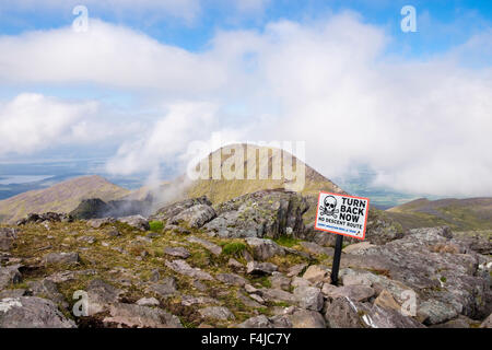 Turn back now sign with skull and crossbones on Carrauntoohil mountain ...