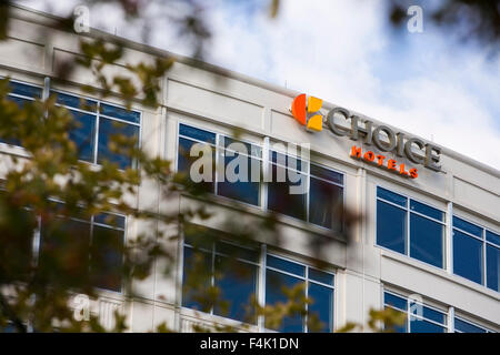 A logo sign outside of the headquarters of Choice Hotels International ...