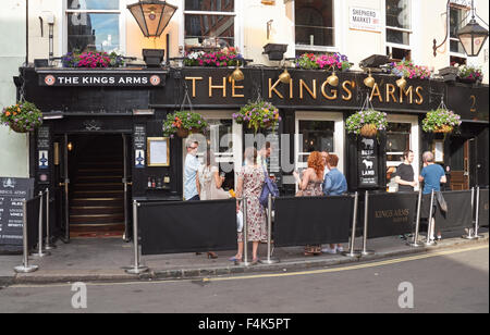 Drinking outside the Kings Arms pub on Roupell Street, Waterloo, London ...