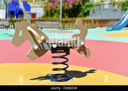 Bouncy colorful spring playground equipment in public park, plastic ...