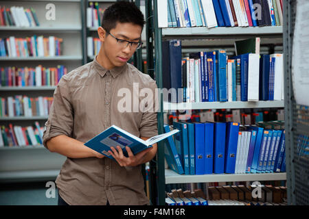 Group of Asian college student reading books and tutoring special class ...