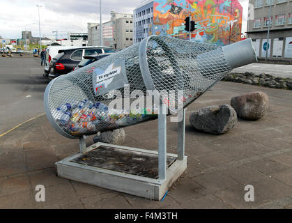 Plastic bottle recycling bins shaped like a bottle along Main Street at ...