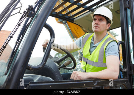 Construction Worker Driving Digger Stock Photo - Alamy