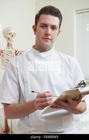 Portrait Of Osteopath In Consulting Room Stock Photo - Alamy