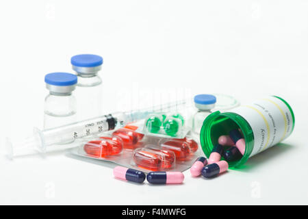 Various cold medications with prescription bottle and syringe Stock ...