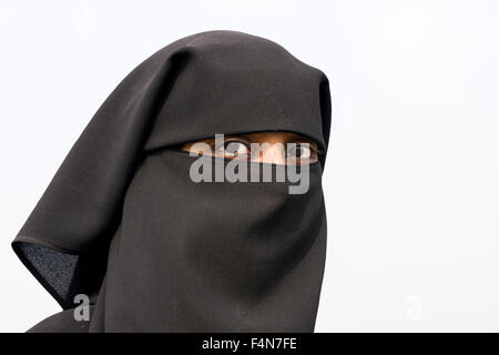 Muslim woman dressed in a burka, in traditional area of Srinagar, Jammu ...