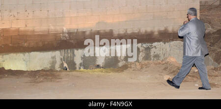 Authorities look over the scene after two helicopters crashed in ...