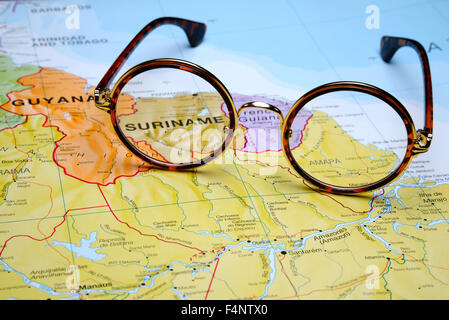 Glasses on a map - Suriname Stock Photo - Alamy