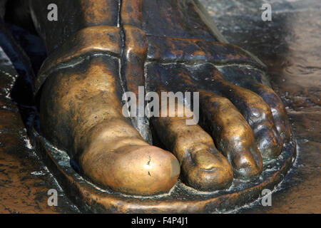 The giant foot of the bronze sculpture of Gregory of Nin and the shiny ...