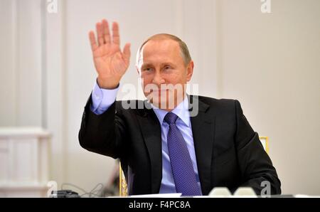 Russian President Vladimir Putin waves after his annual news conference ...