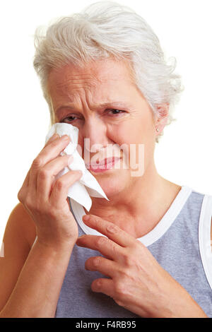 Old senior woman crying and drying her tears with a handkerchief Stock ...