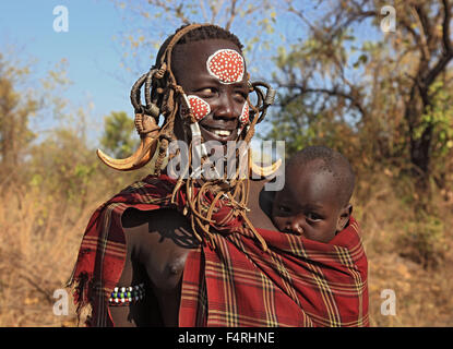 Mursi People Children in National Costumes in the Tribe Village Stock ...