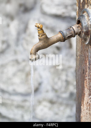 Dripping, drooping, leaking old tap Stock Photo - Alamy