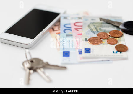 Close up of Keys car and money coin in jar place on wood table.Concept ...